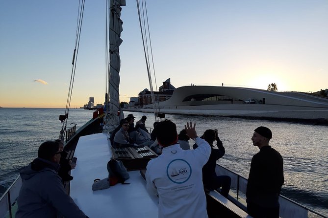 2-Hour Lisbon Traditional Boats Sunset Cruise with White Wine - Authenticity and Atmosphere