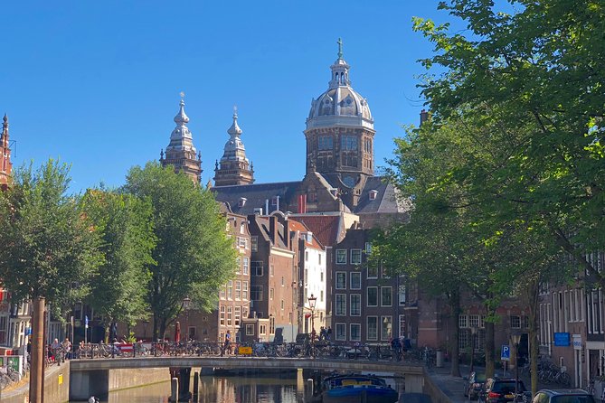 Absolutely Amsterdam - the Essential Introductory Walking Tour - Dutch Cycling Culture and Royal Heritage