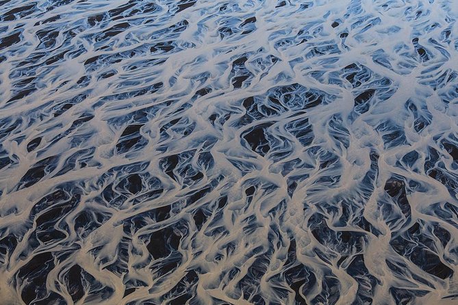 Airplane tour over black sands and riverbeds from Skaftafell - The Sum Up