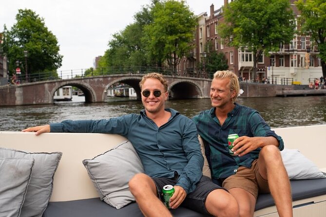 Amsterdam: Evening City Centre Canal Cruise With Unlimited Drinks - Sights and Highlights Along the Cruise