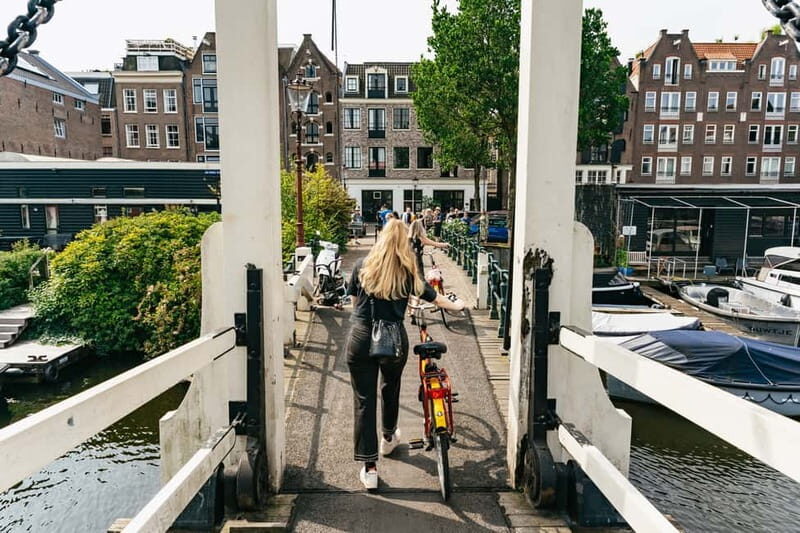 Amsterdam: Guided Bike Tour City Centre in EN/DE/FR/ES - Key Points