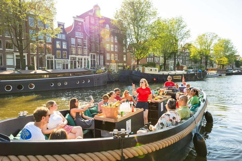 Amsterdam: Guided Open Boat Canal Cruise Including Drink - The Value of the Tour