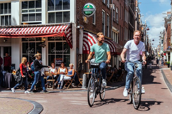 Amsterdam PRIVATE Bike Tour With Locals: Bike & Local Snack Included - Meeting and Logistics