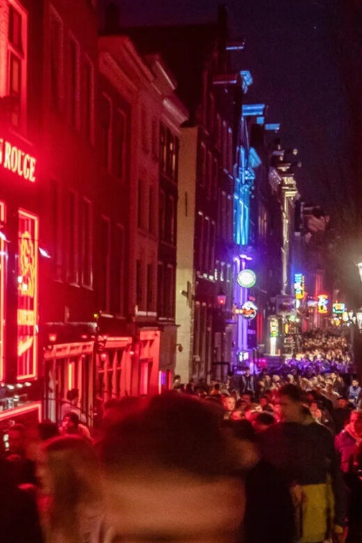 Amsterdam: Spanish Tour Unmasking the Redlight District - Starting Point: Barbizon Palace Hotel