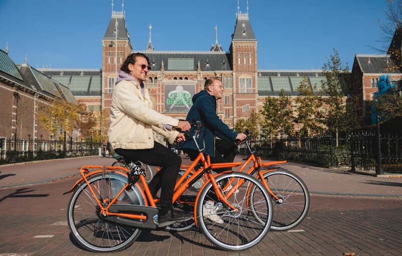 Amsterdam: Top Highlights Guided Bike Tour EN/DE/ES/FR/IT/CN - The Value of Guided Bike Tours in Amsterdam