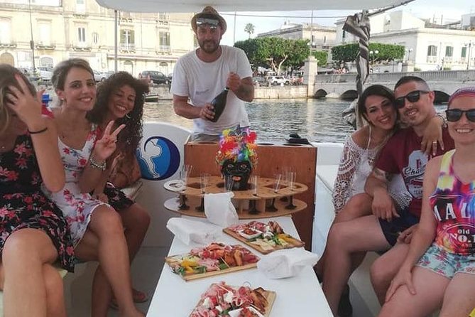 Aperitif on the Boat at Sunset Island and Sea Caves - Meeting Point and Tour Logistics