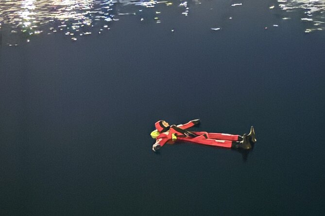 Arctic Ice Floating in Warm Survival Suit Tromsø - Safety Procedures and Guide Expertise