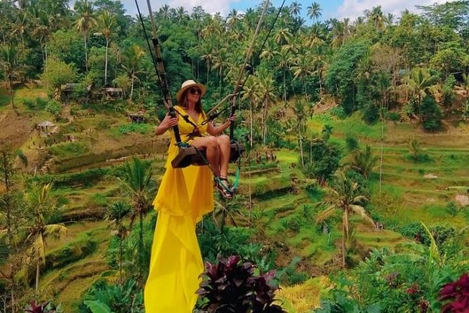 Best of Bali Jungle Swing with Ubud Sightseeing Tour - Visiting Ubud’s Sacred Temples and Markets