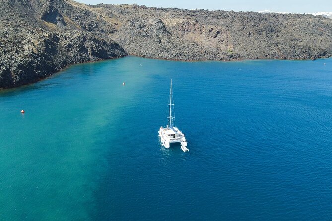 Best of Santorini Private Half-Day Catamaran Cruise With Transfer and Meal - Itinerary Highlights