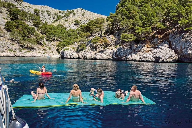Catamaran Cruise From Port Dalcudia With Lunch and Swim Stop - Snorkeling and Kayaking Opportunities