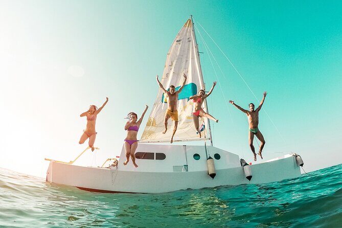 Catamaran to Isla Mujeres Snorkeling, Beach Club and Lunch Tour - Key Points