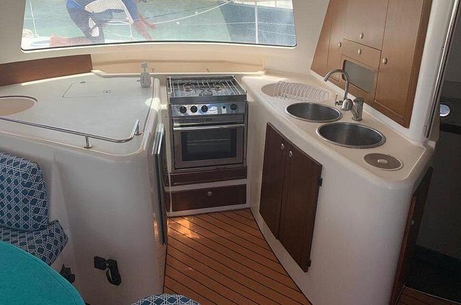 Catamaran Tour to Isla Mujeres Snorkeling with Buffet and Open Bar - The Sum Up