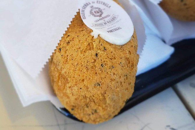 Eat & Tell Portos Tale: the Historical Tour That Goes Through Your Stomach! - Tasting Local Delicacies at Torre Dos Clerigos