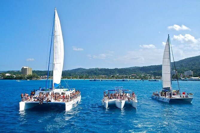 Exotic Catamaran Party Cruise and Snorkeling to Dunns River Falls - Key Points