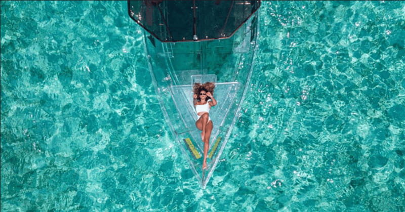 Explore the sea of cozumel in a transprent boat with drinks and snorkel. - Key Points