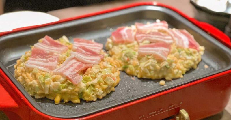 Family-Friendly Night Out in Shibuya: Food, Drinks & Games! - Culinary Delights: Mastering Okonomiyaki and Yakisoba