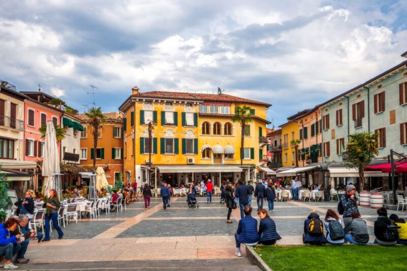 Festive Journey in Sirmione Christmas Walking Tour - Exploring Piazza Castello