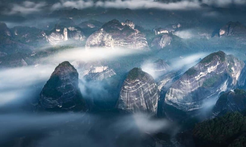 From Guilin: Danxia Peaks & Guangxi-Hunan Tribal Trails Tour - The "Whales in Mist": A Surreal Sea of Clouds