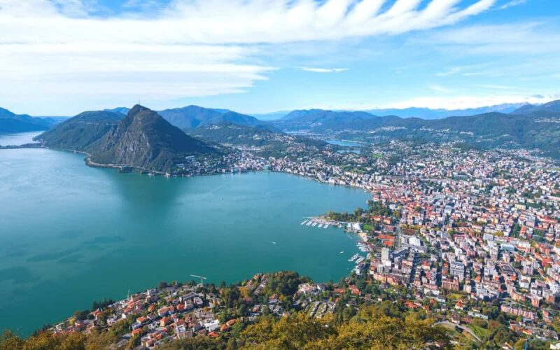 From Milan: Lugano, Bellinzona and Chocolate Factory Trip - Roundtrip Transportation