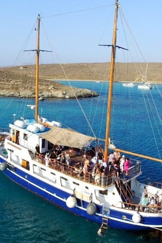 From Mykonos: Delos & Rhenia Islands Half-Day Trip by Boat - Onboard Entertainment and Atmosphere