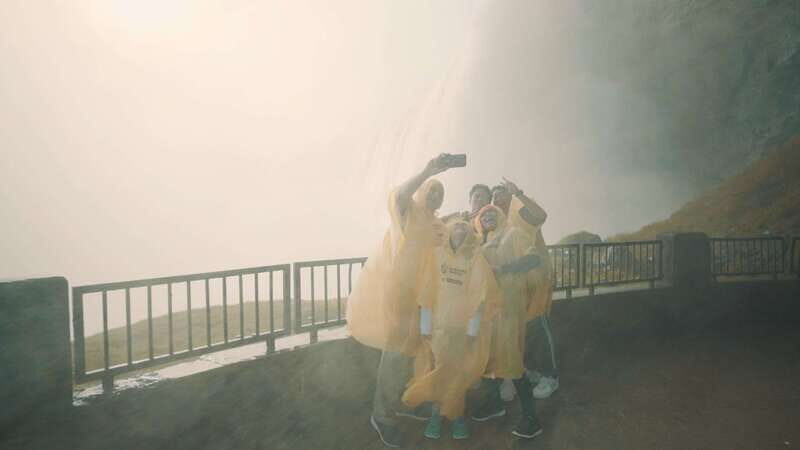 From Niagara Falls, USA: Canadian Side Tour w/ Boat Ride - Journey Behind the Falls: A Tactile Encounter with Nature