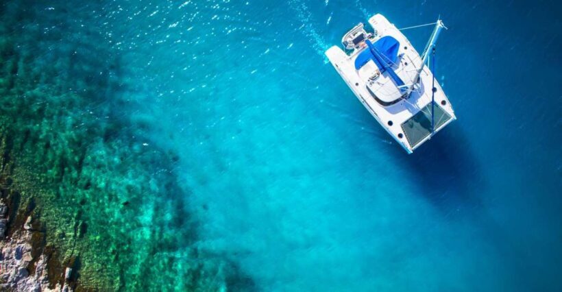From Ornos: Mykonos Delos Catamaran Cruise with Meal & SUP - Key Points