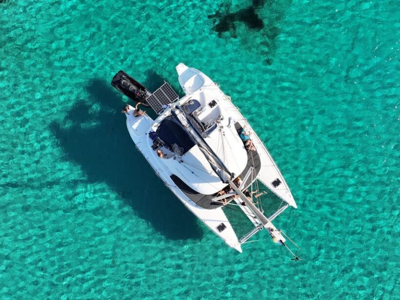 From Ornos: Mykonos Delos Catamaran Cruise with Meal & SUP - The Sum Up