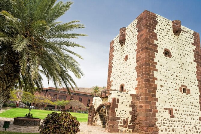 Full-Day Bus Tour to La Gomera Island With Professional Guide - Transportation and Pickup Information