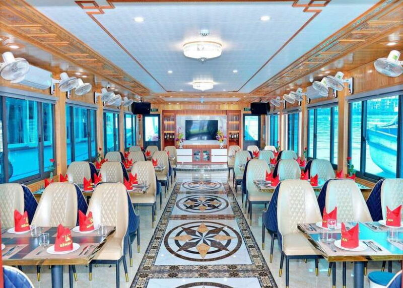 Halong Bay: Day Cruise with Caves, Kayaking & Sunset Party - Titop Island: Relaxation and Panoramic Views