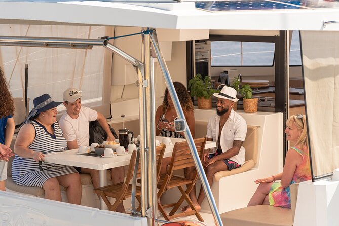 Hersonissos: Sunset Catamaran Cruise With Snacks and Drinks - Inclusions and Amenities