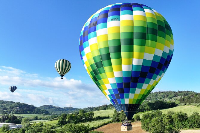 Hot air balloon over the hills of Pienza, Montalcino and Val D'Orcia - The Sum Up