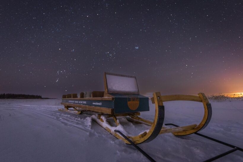Ii: Snowmobile sleigh trip on frozen sea under starlit sky - The Value of This Arctic Adventure
