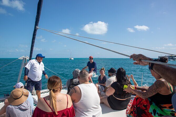Isla Mujeres Catamaran Tour with Optional Pick-Up & Beach Club - Snorkeling in Coral Reefs: A Highlight