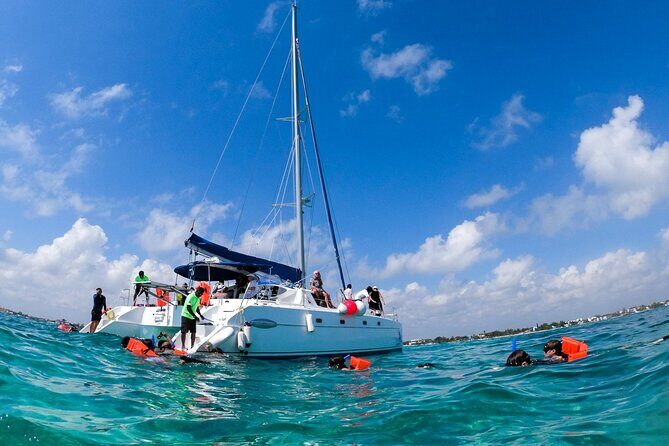 Isla Mujeres Tour on Catamaran with Snorkel, Open Bar, Buffet & Beach club - The Sum Up