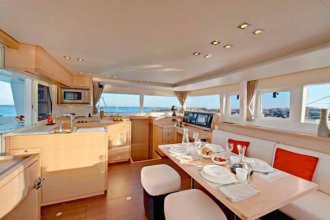 Island Hopping: Santorini Catamaran Charter Cruise With a Skipper - Onboard Amenities and Services