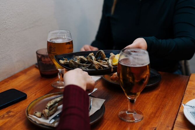 Lisbon Guided Walking Food Tour With Dinner and Drinks - Exploring Octopus Salad and Grilled Sardines