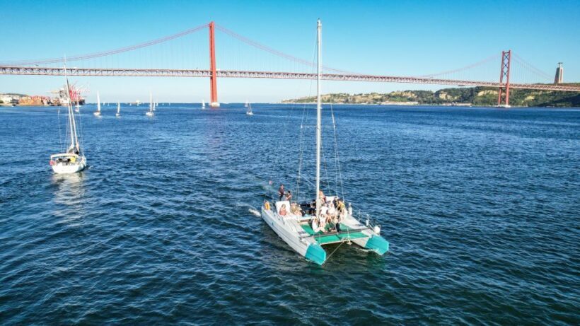 Lisbon: Sunset Catamaran Tour with Music and Drink - The Sum Up