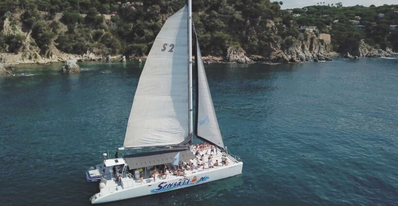 Lloret de Mar: Sunset Catamaran Cruise with DJ and Drinks - Key Points