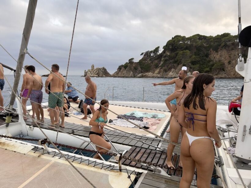 Lloret de Mar: Sunset Catamaran Cruise with DJ and Drinks - The Sum Up