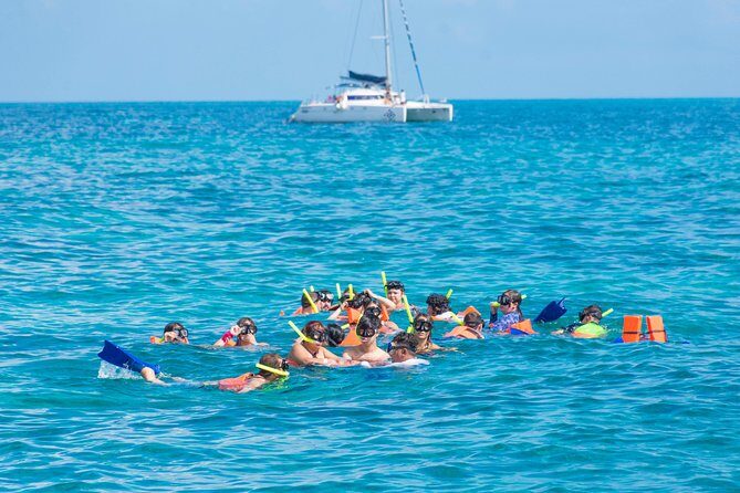 Luxury Catamaran tour to Isla Mujeres with transportation from Playa del Carmen - How the Experience Unfolds