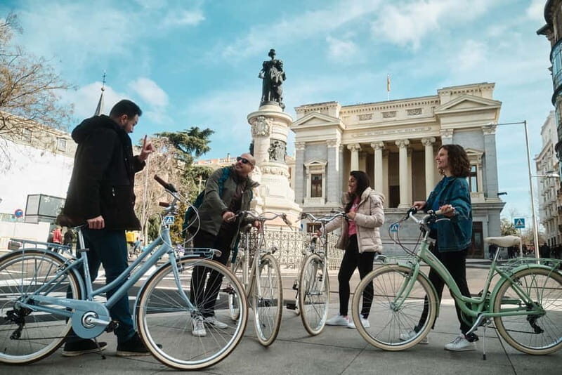 Madrid: Highlights Guided Vintage Bike Tour and Tapas Option - Authentic Experiences and Review Highlights
