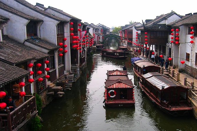 Mini Group: One-Day Zhouzhuang and Jinxi Water Town Tour - Authenticity and Guide Quality
