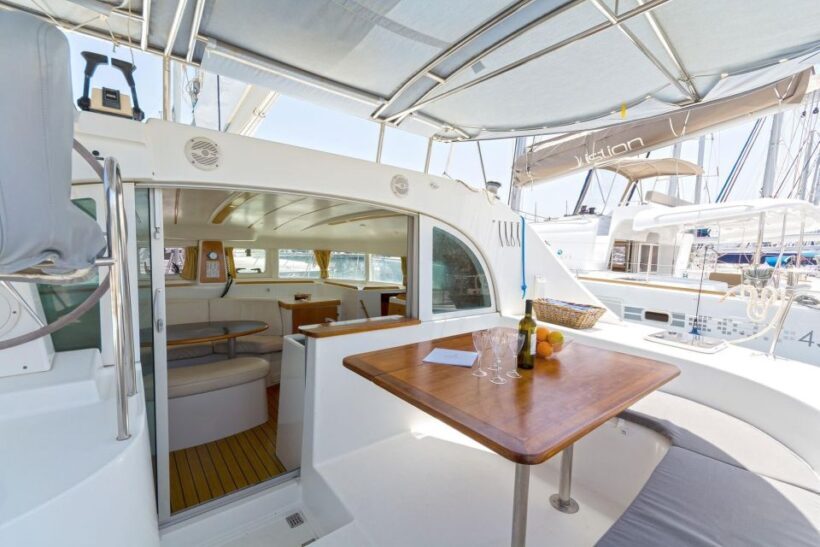 Mykonos: Private Catamaran Cruise w/ Food, Drinks & Transfer - The Sum Up