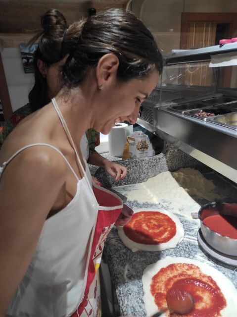 Naples: Small Group Pizza Making with Drink Included - Enjoying Your Creation with a Drink