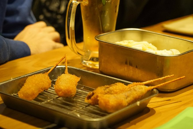 Osaka Local Foodie Walking Tour in Dotonbori and Shinsekai - Exploring Dotonbori and Shinsekai Neighborhoods