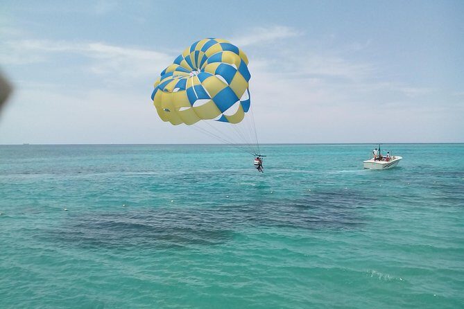 Parasailing Snorkeling and Glass Boat Adventure in Negril - Key Points