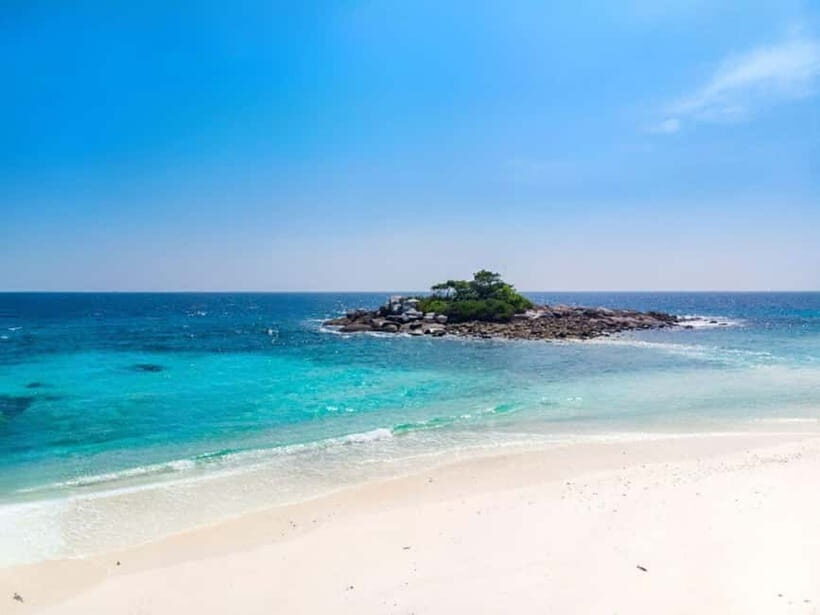 Phuket: Coral and Racha Island Yacht Tour with Lunch - Return Journey and Sunset Views