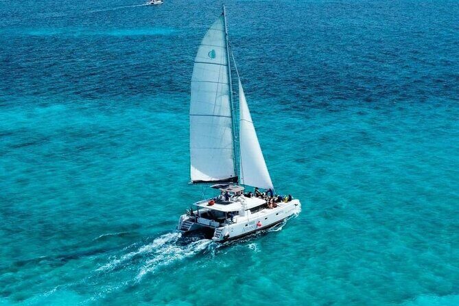 Plus Full Day Catamaran Tour to Isla Mujeres All Inclusive - Island Exploration and Beach Club