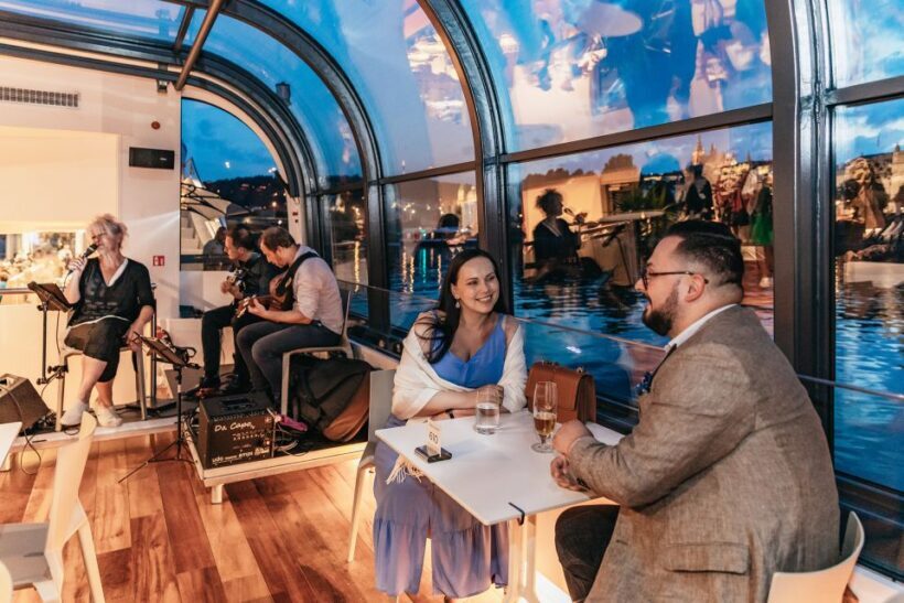 Prague: Sightseeing Dinner Cruise on Open-Top Glass Boat - Onboard Experience: Food, Music, and Atmosphere