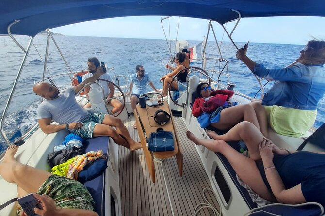 Private Sailing Boat Experience with Lunch and Drink in Palermo - First Stops: Porto Arenella and Faro di Capo Gallo